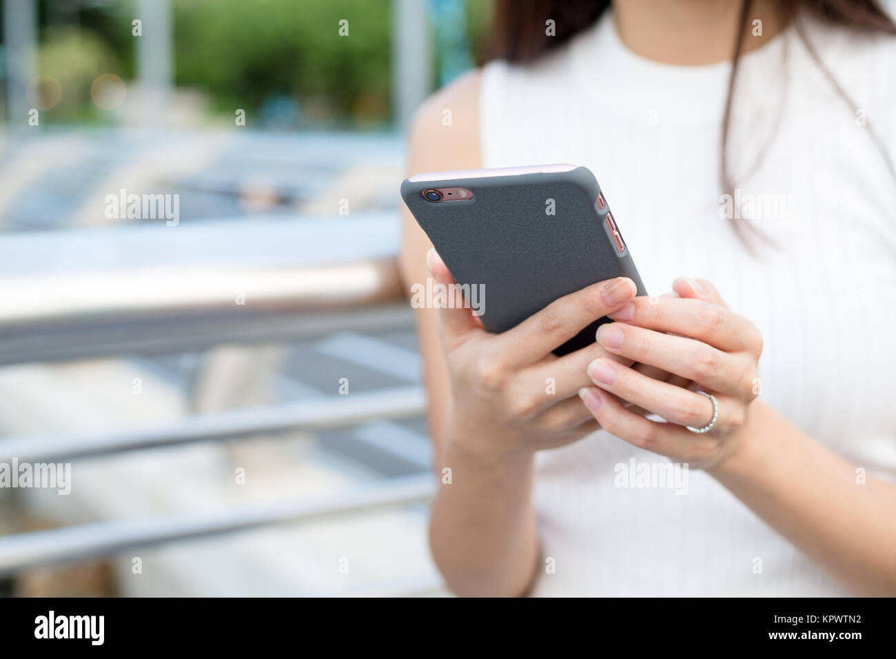 Woman using a smartphone Stock Photo - Alamy
