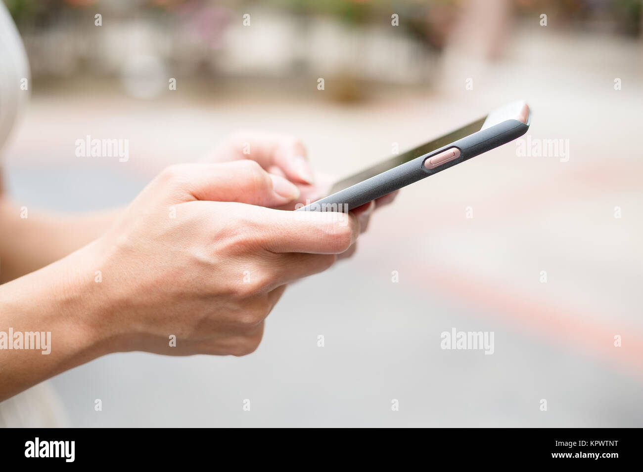 Woman hand touching on cellphone Stock Photo - Alamy