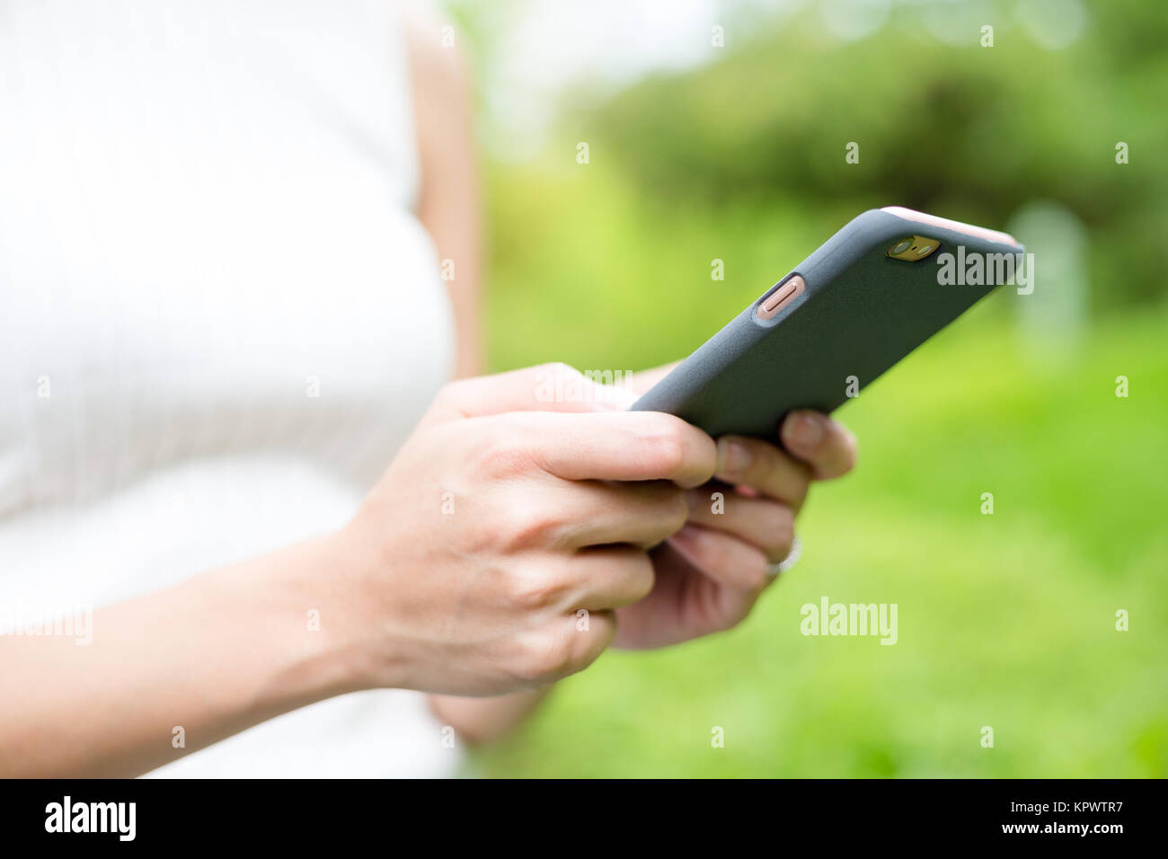 Woman sending text message on cellphone Stock Photo - Alamy