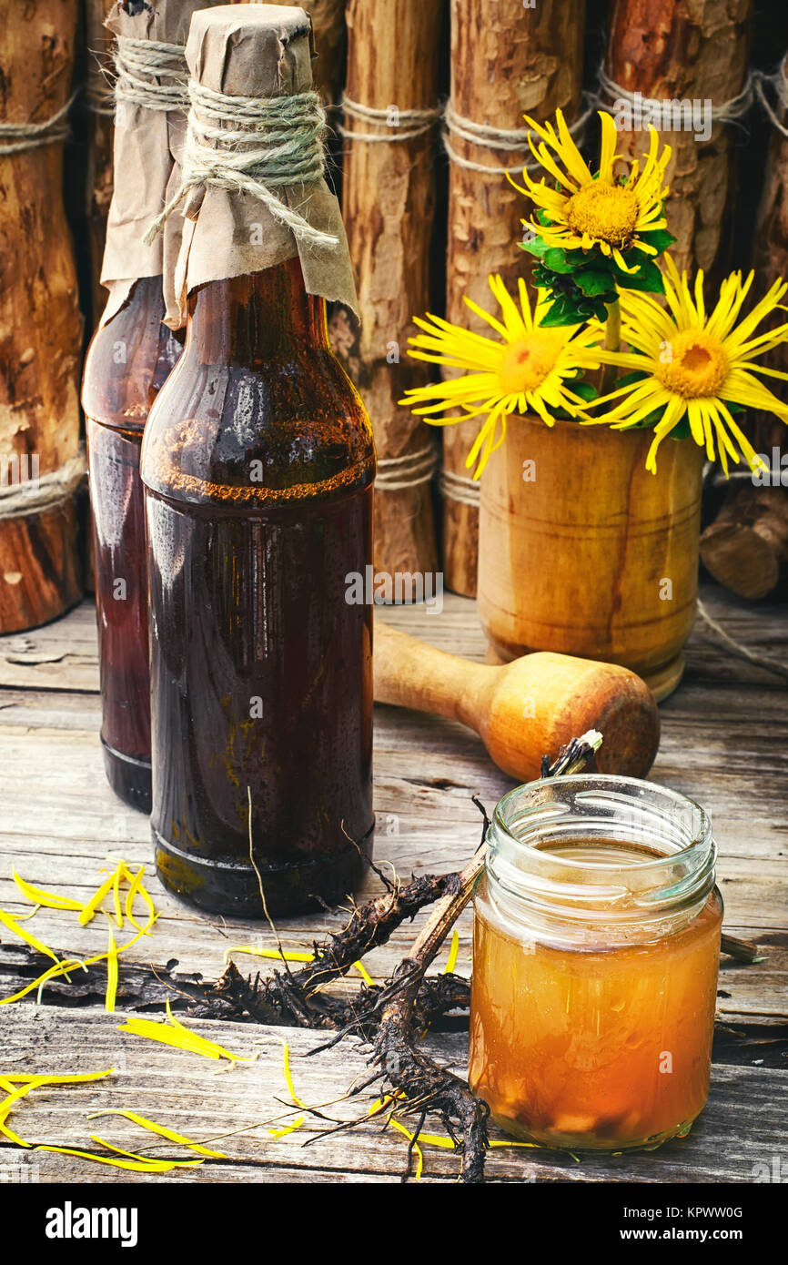 Medicinal folk remedy tincture from the roots of inula Stock Photo - Alamy