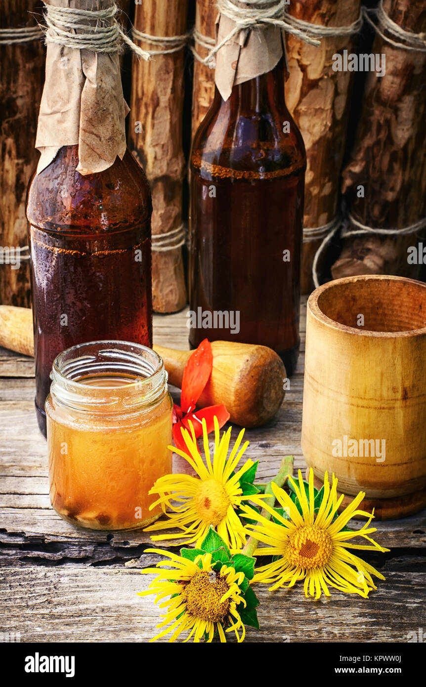 Medicinal folk remedy tincture from the roots of inula Stock Photo - Alamy
