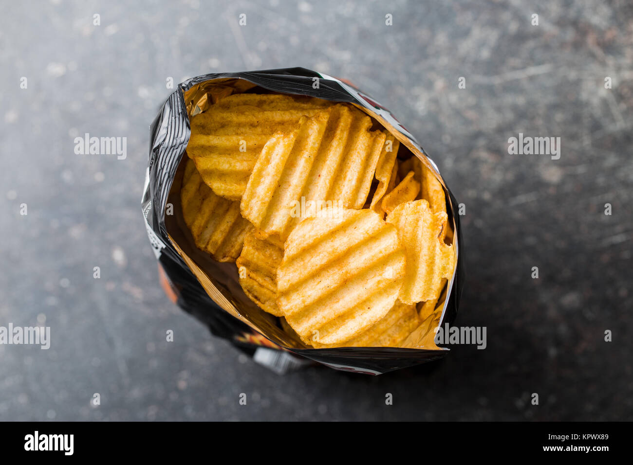 Crinkle cut potato chips Stock Photo - Alamy