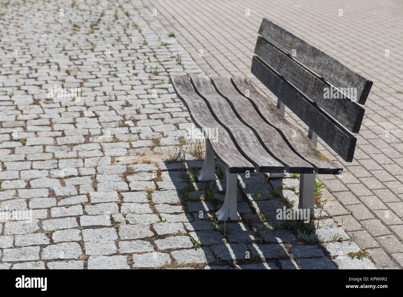 empty wooden bench on street Stock Photo - Alamy