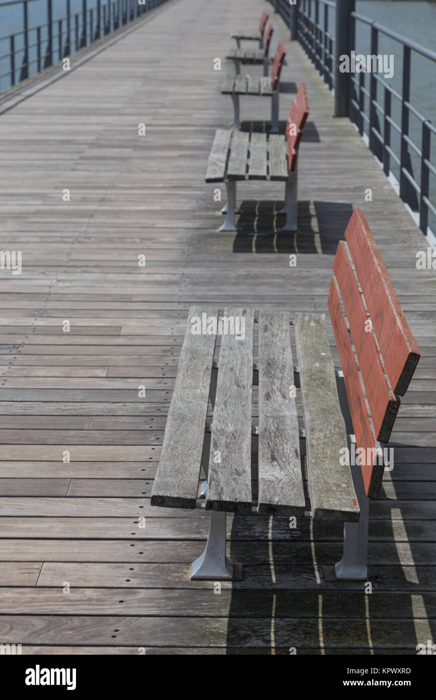 empty wooden bench on footbridge Stock Photo - Alamy