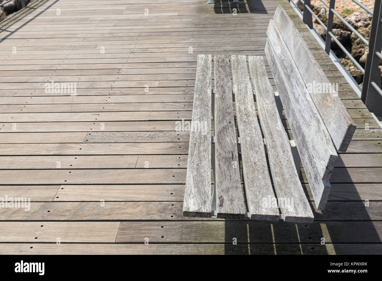 empty wooden bench on footbridge Stock Photo - Alamy