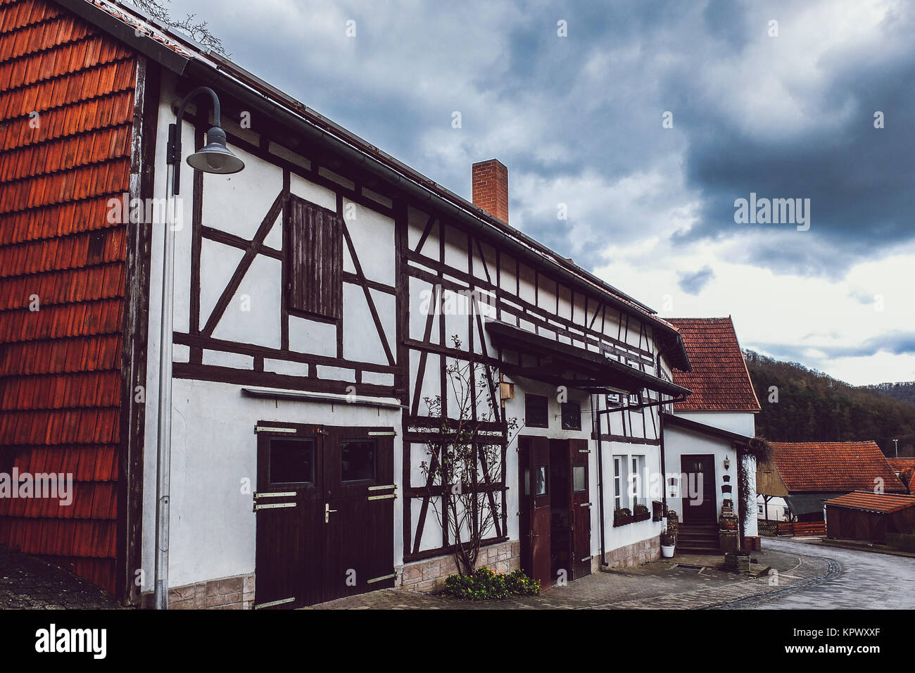 farm house in village Stock Photo - Alamy