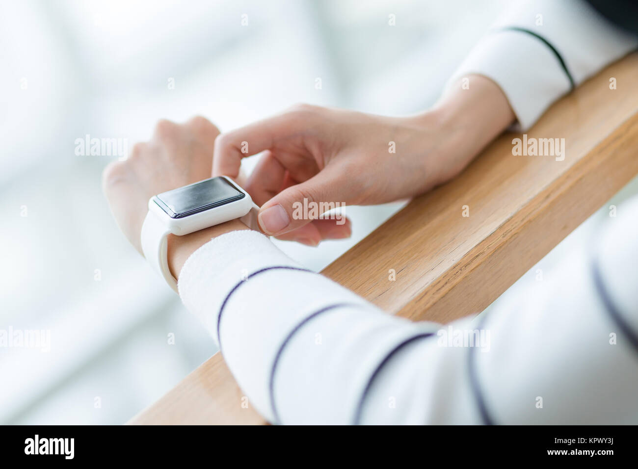 Woman touch on smart watch Stock Photo - Alamy