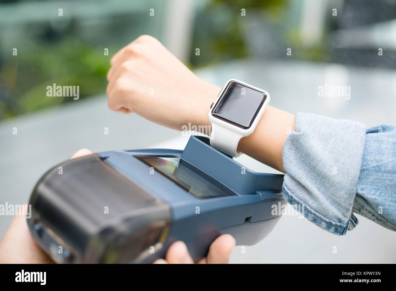 Woman pay on smart watch with NFC technology Stock Photo - Alamy
