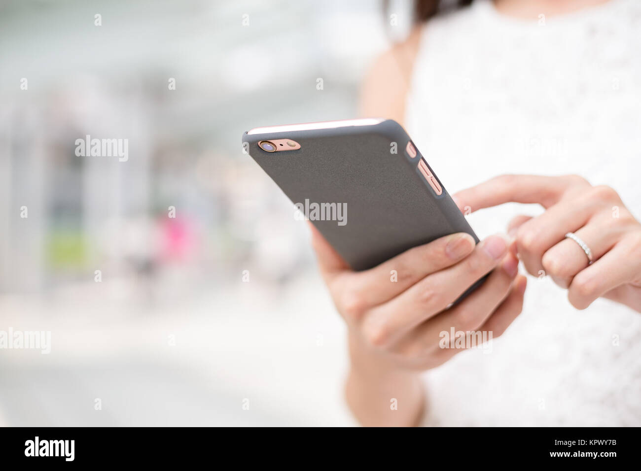 Woman holding on phone Stock Photo - Alamy