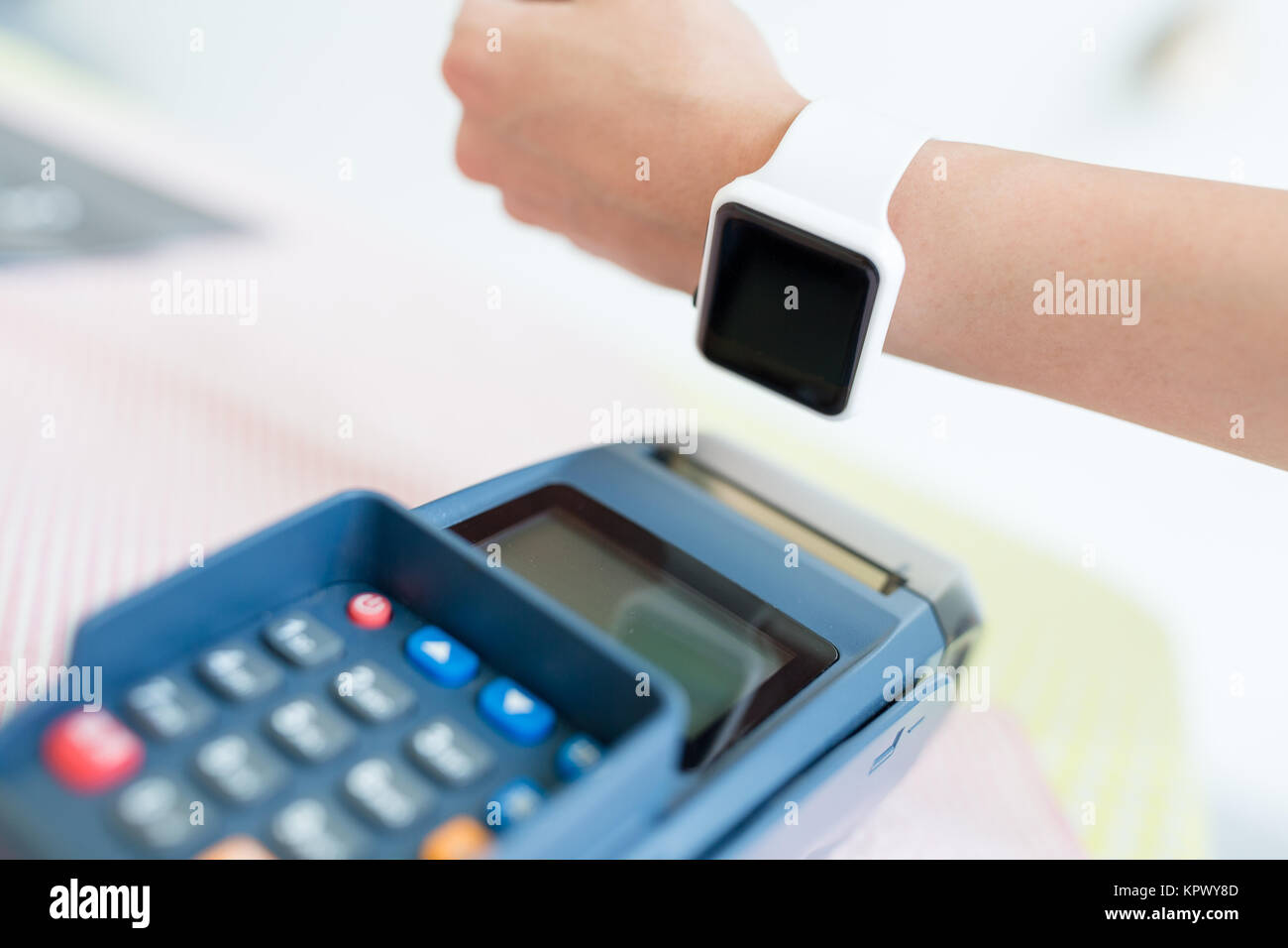 Customer paying with NFC technology with smart watch Stock Photo - Alamy