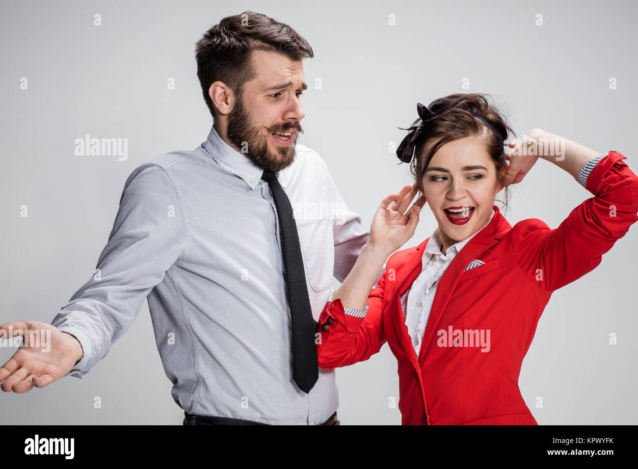 The business man and woman communicating on a gray background Stock ...