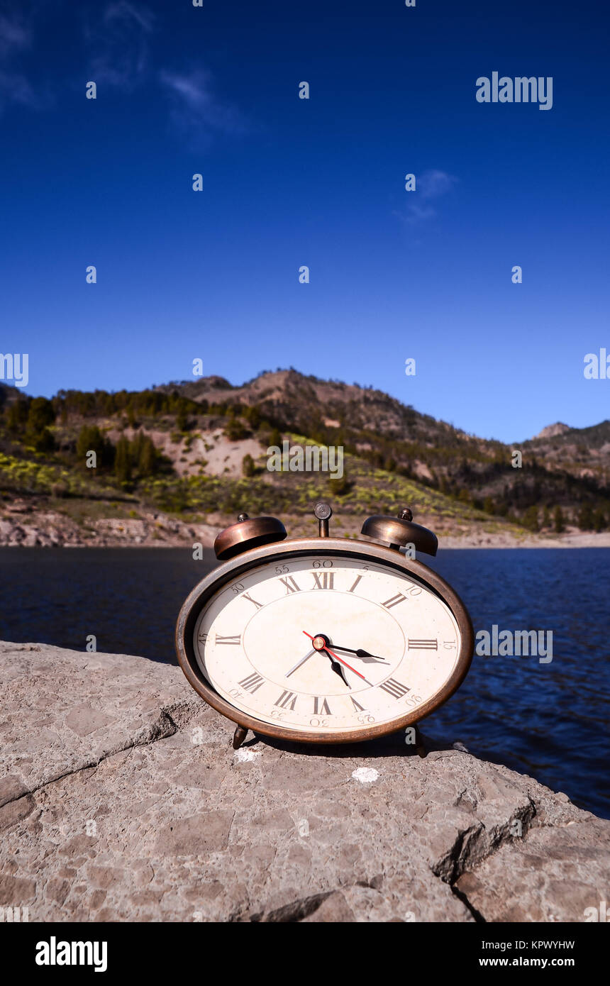 Time Concept Classic Vintage Pocket Clock on the Volcanic Rocks Stock ...