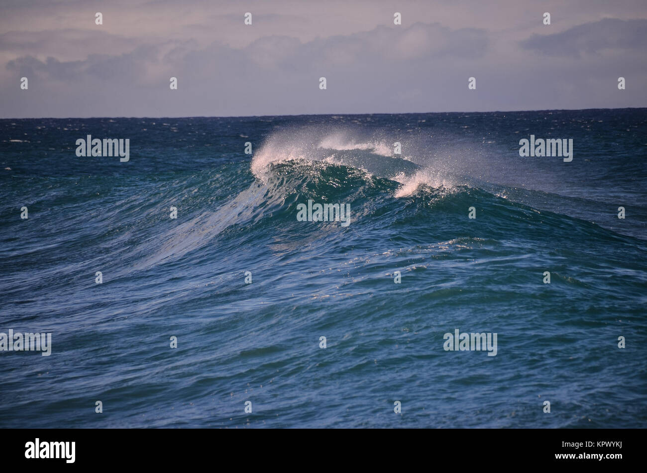 Big Blue Wave Breaks in the Atlantic Ocean Stock Photo - Alamy