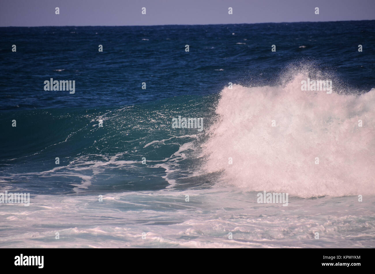 Big Blue Wave Breaks in the Atlantic Ocean Stock Photo - Alamy
