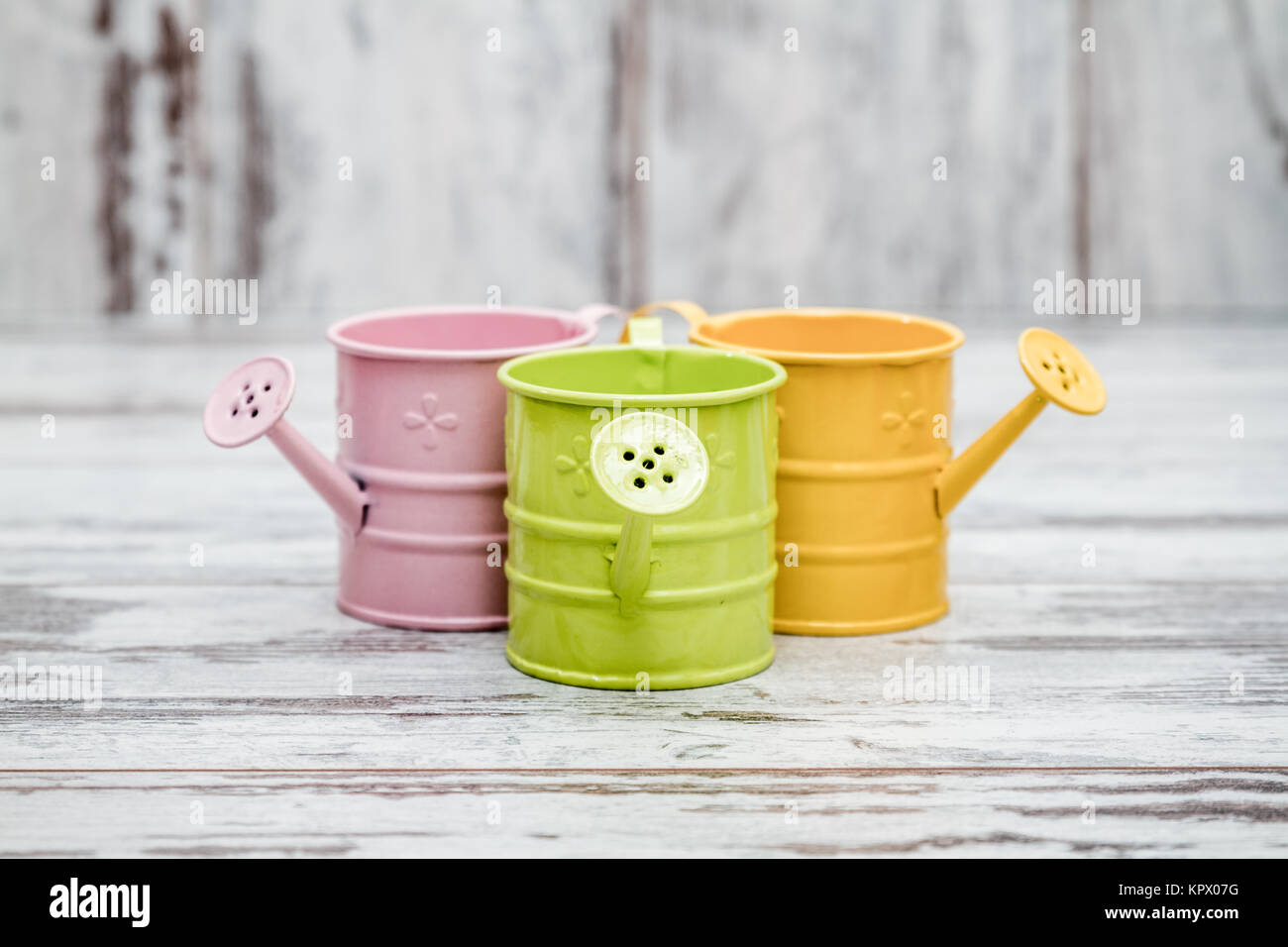 Simple Colorful Metallic Watering Cans Stock Photo - Alamy