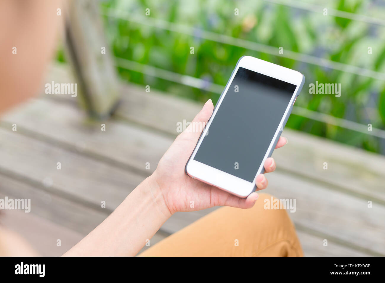 Woman hold with phone Stock Photo - Alamy