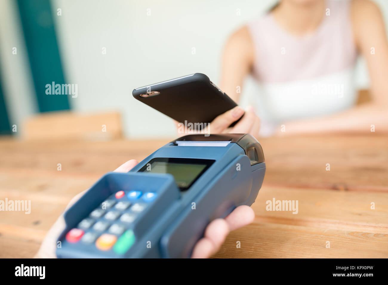 Woman checkout by mobile phone Stock Photo - Alamy