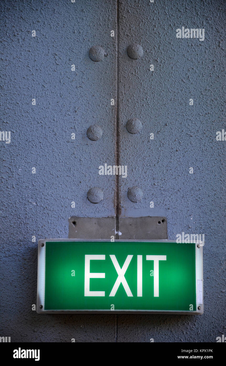 Exit sign points the way out Stock Photo - Alamy