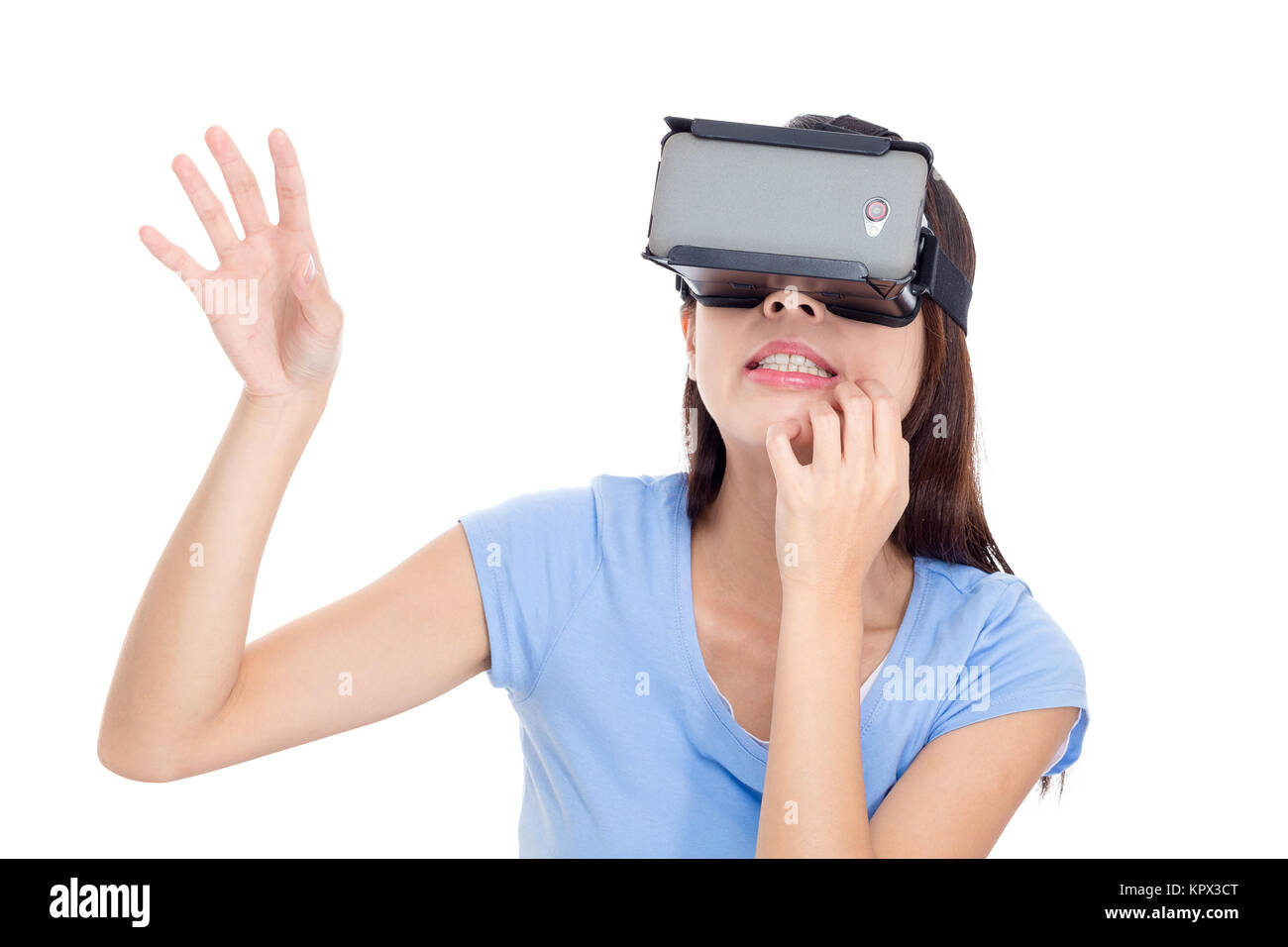Young woman looking though virtual reality device Stock Photo - Alamy