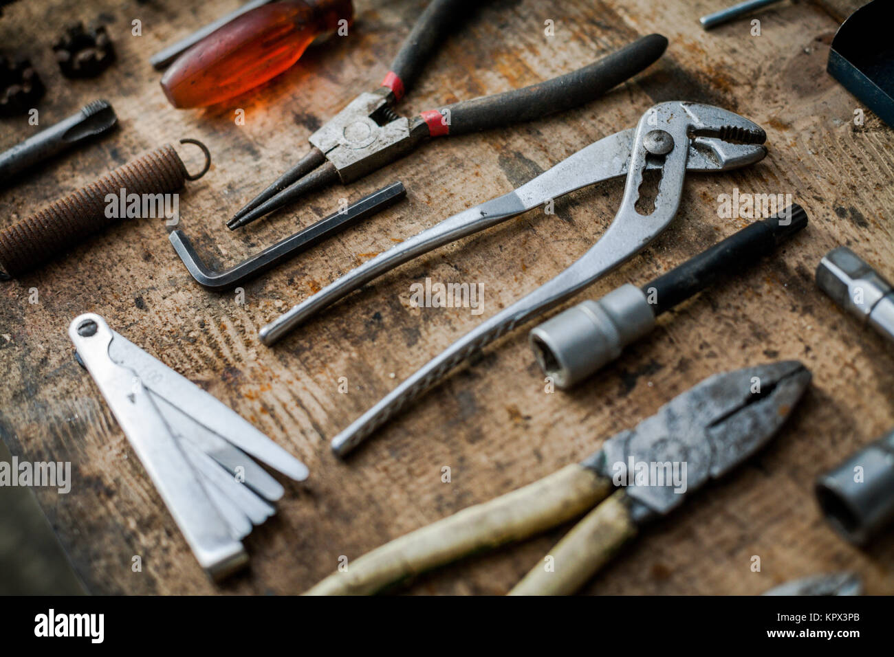 Tools on wooden plank Stock Photo - Alamy