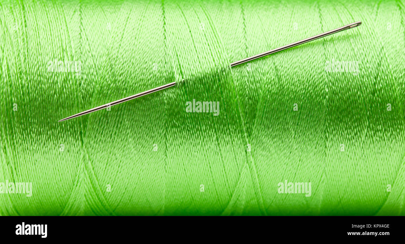 Thread and needle Stock Photo - Alamy