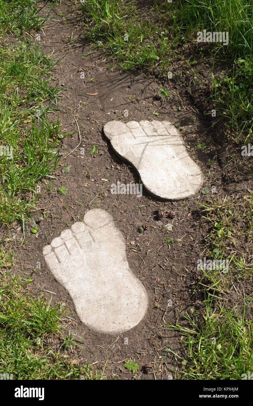 a wooden foot in soil and grass Stock Photo - Alamy