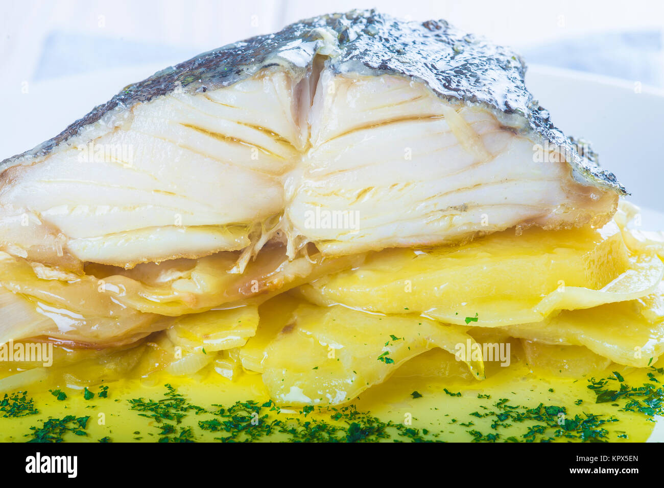 Oven baked cod fish with potatoes Stock Photo - Alamy