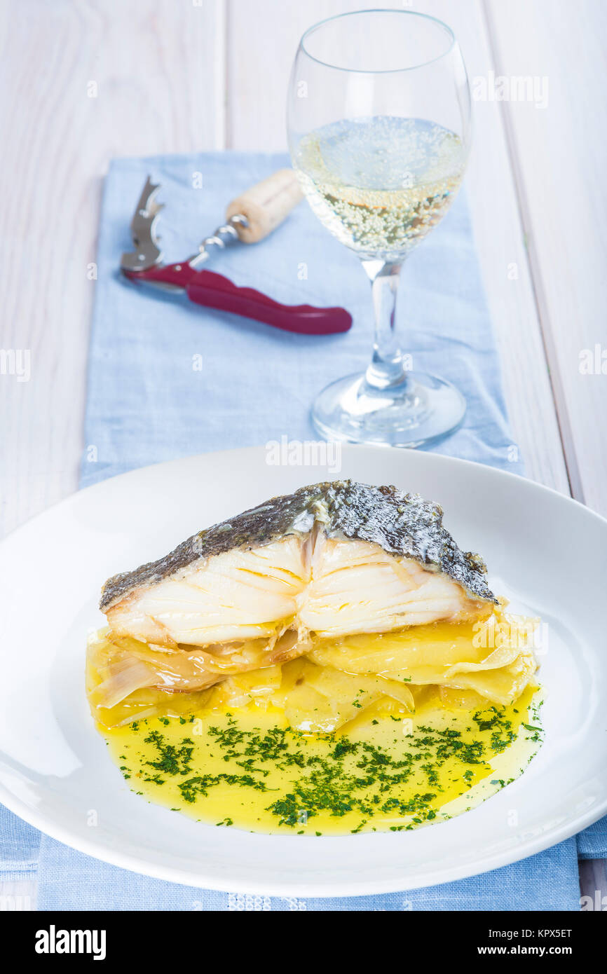 Oven baked cod fish with potatoes Stock Photo - Alamy