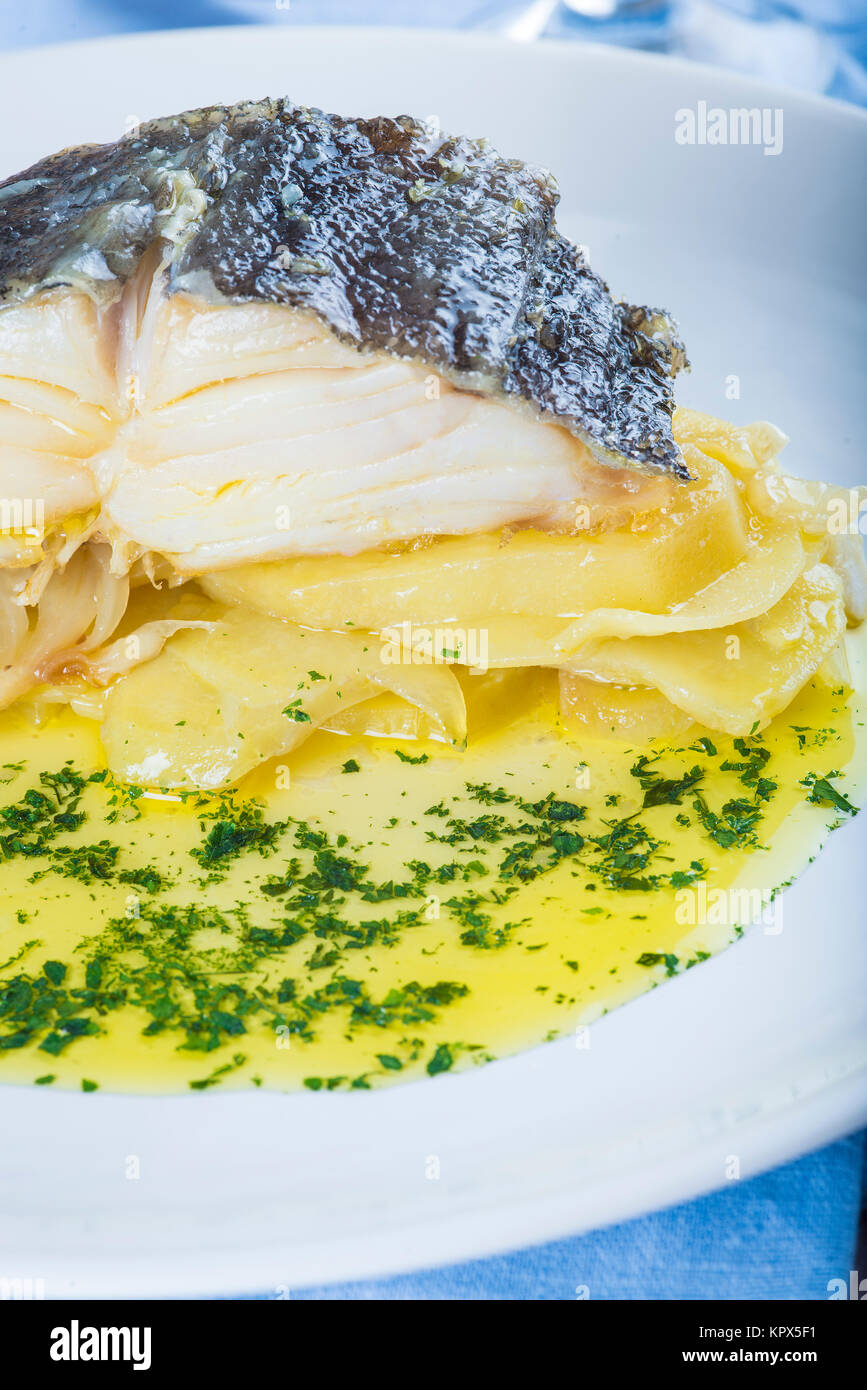 Oven baked cod fish with potatoes Stock Photo - Alamy
