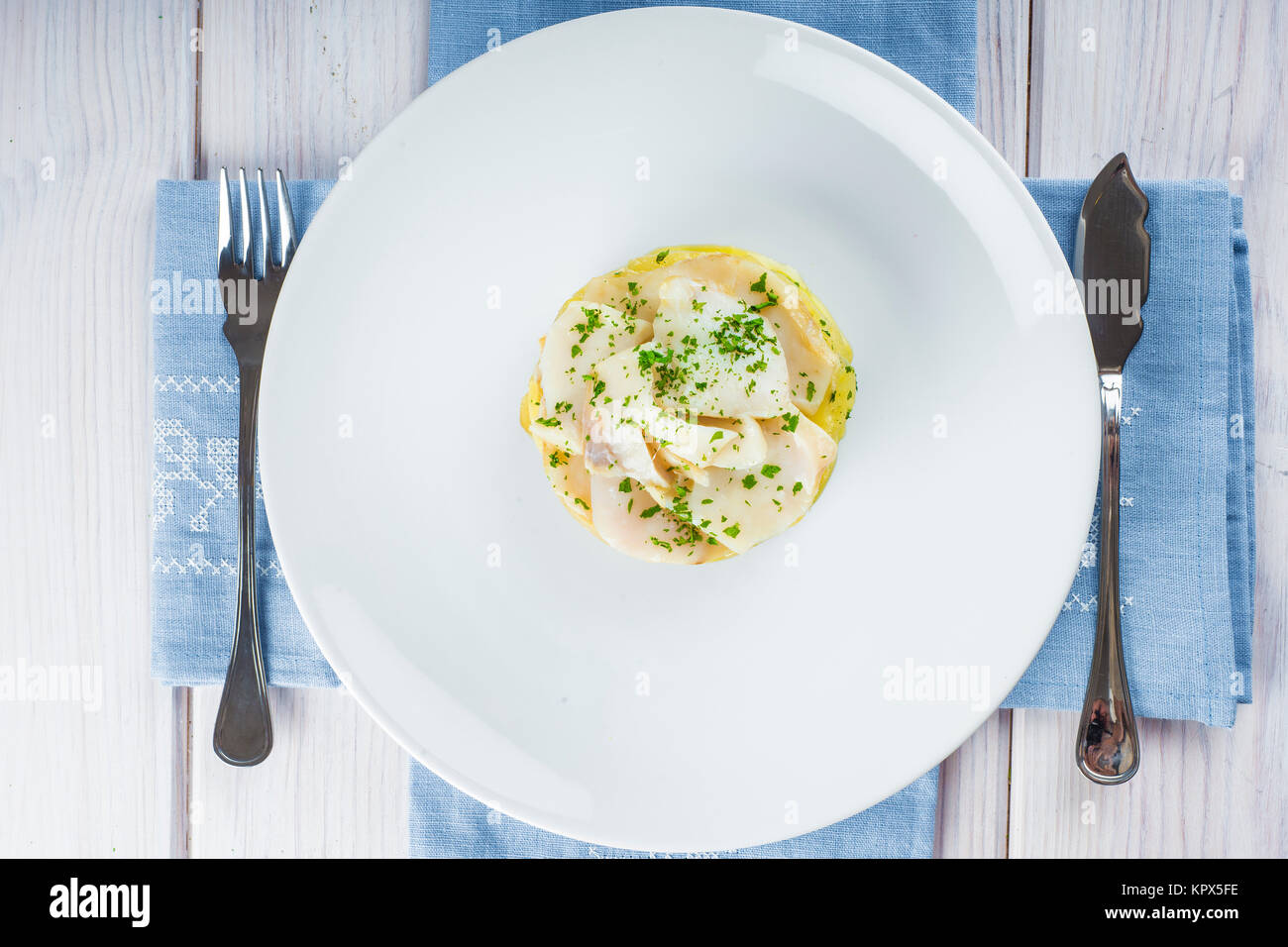 Oven baked cod fish with potatoes Stock Photo - Alamy