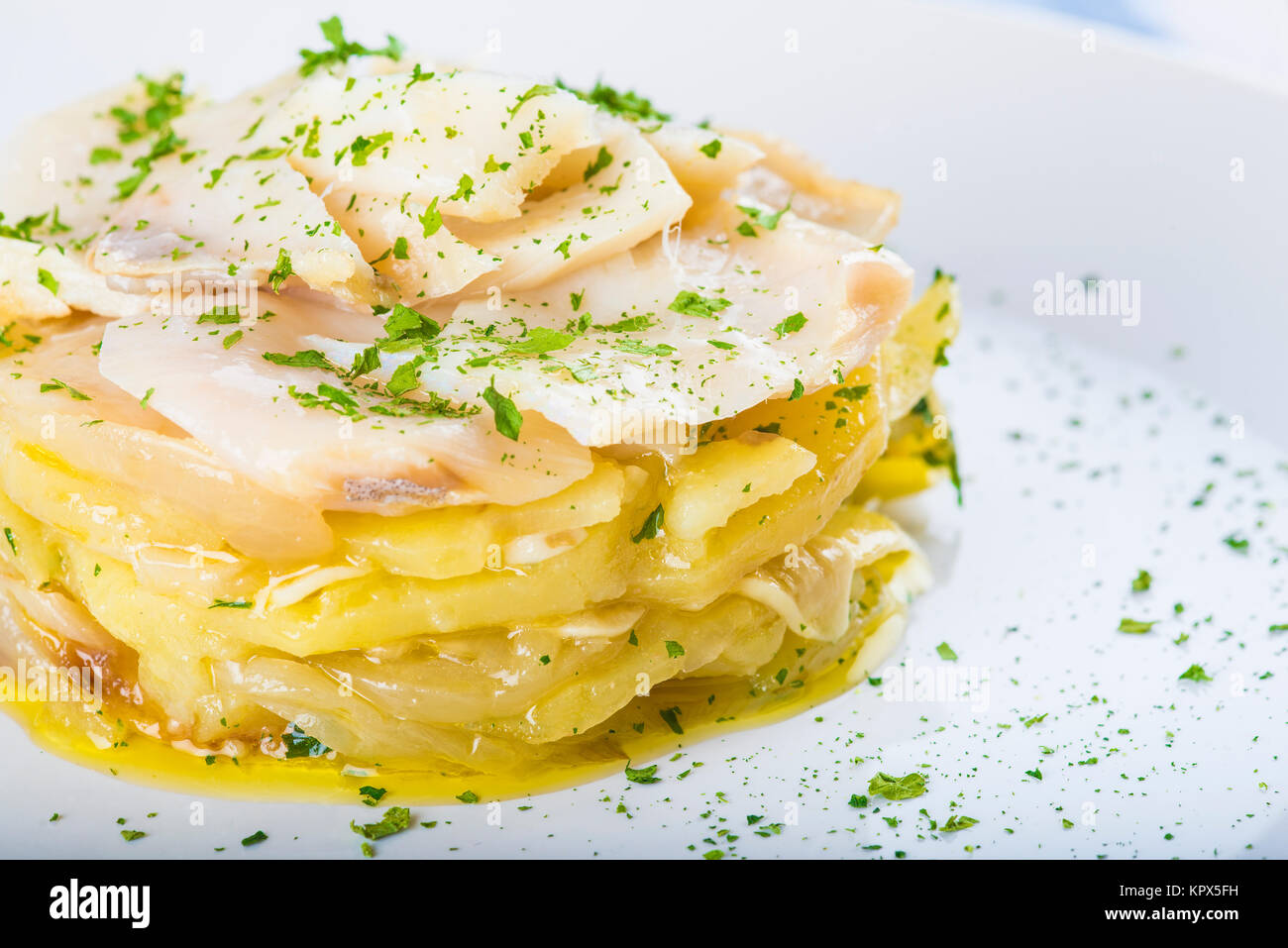 Oven baked cod fish with potatoes Stock Photo - Alamy