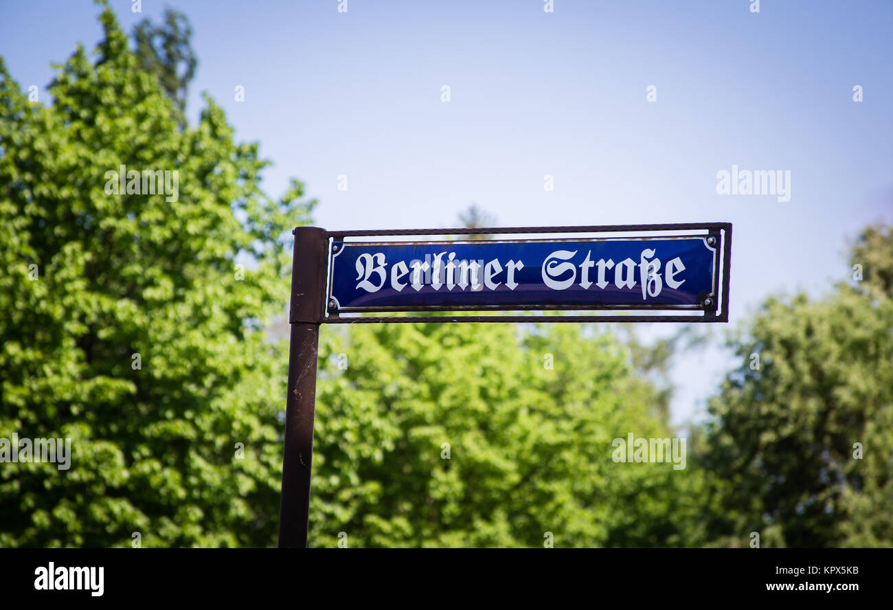 German road sign Berliner Strasse in front of trees Stock Photo - Alamy