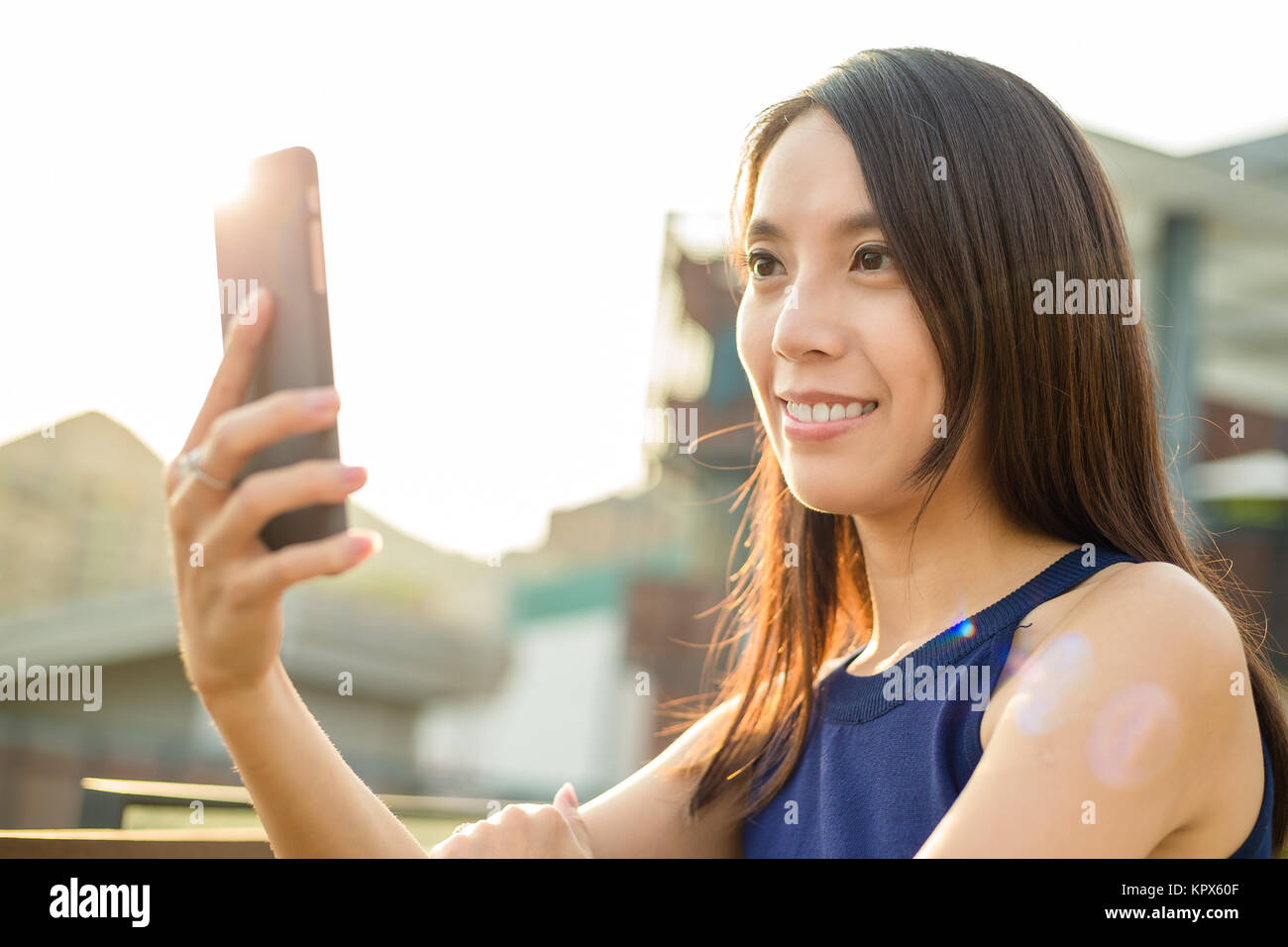 Woman use of cellphone at outdoor Stock Photo - Alamy