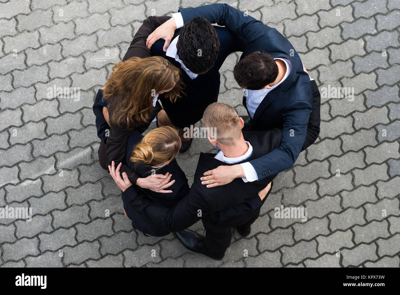 Huddle group hi-res stock photography and images - Alamy