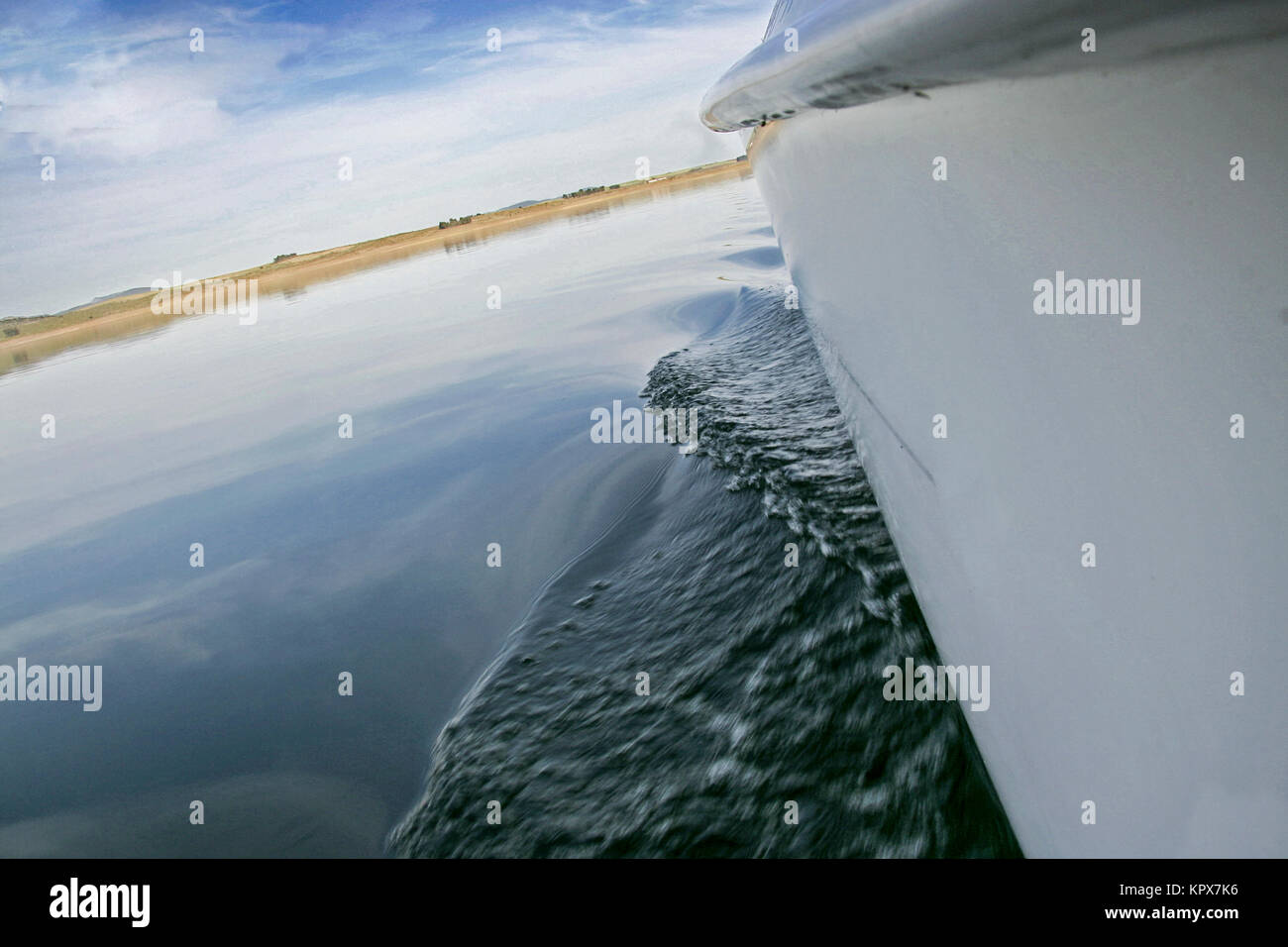 Gunwale view of sailboat sailing across Alange Reservoir, Spain Stock ...