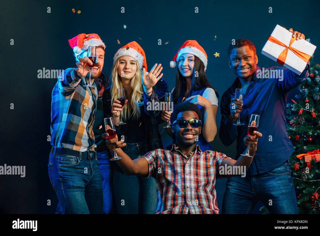 Happy group of friends touching the glases with each other Stock Photo ...