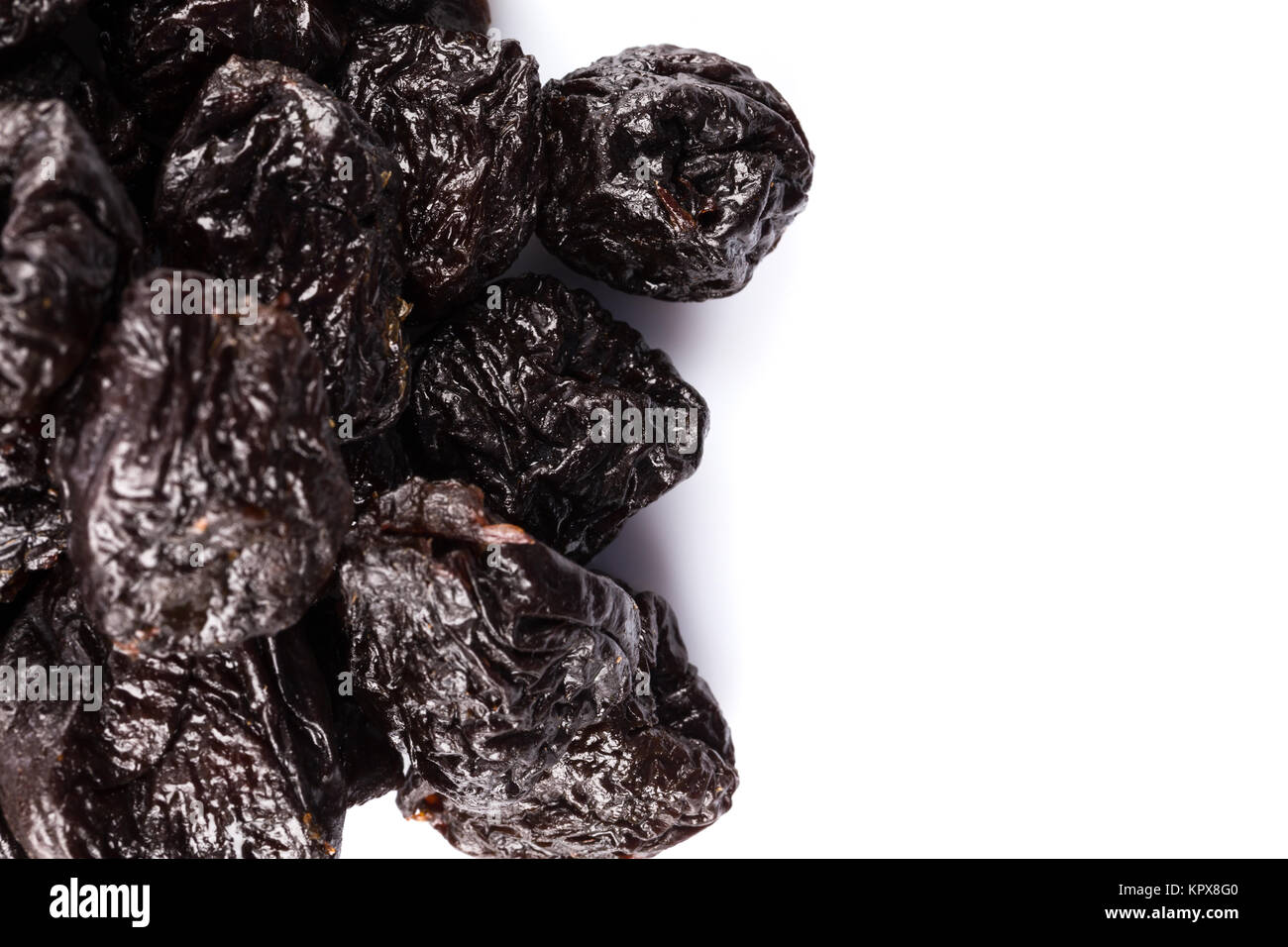 Dried plum - prunes isolated Stock Photo - Alamy