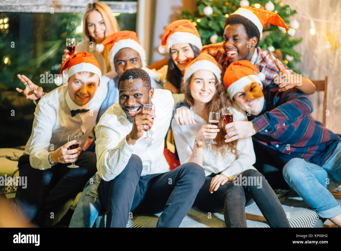 Happy group of friends touching the glases with each other Stock Photo ...