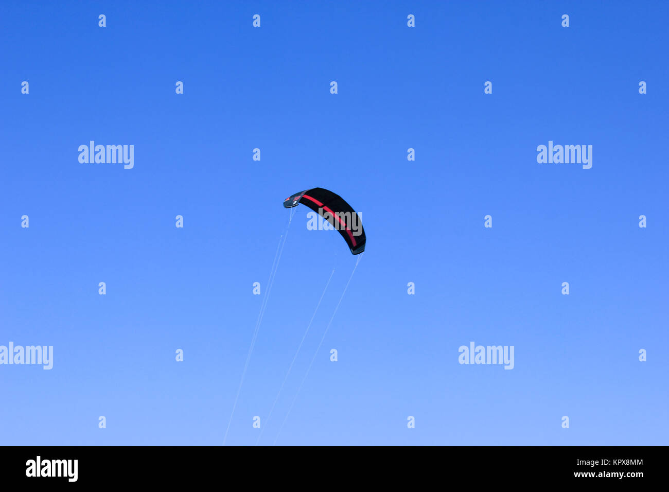 Parasail on blue sky Stock Photo - Alamy