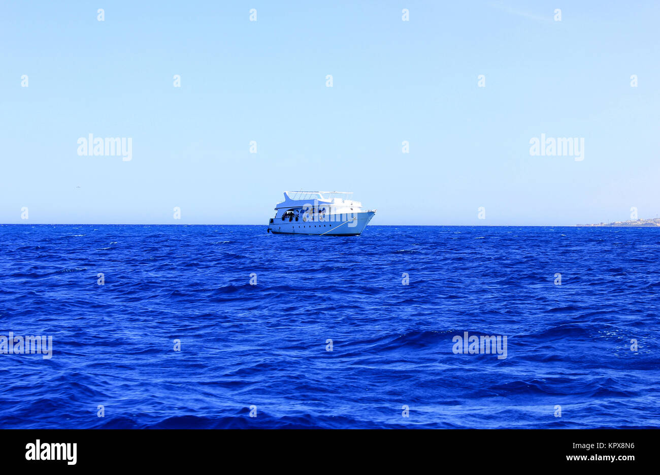 White Ship floats on Water Stock Photo - Alamy