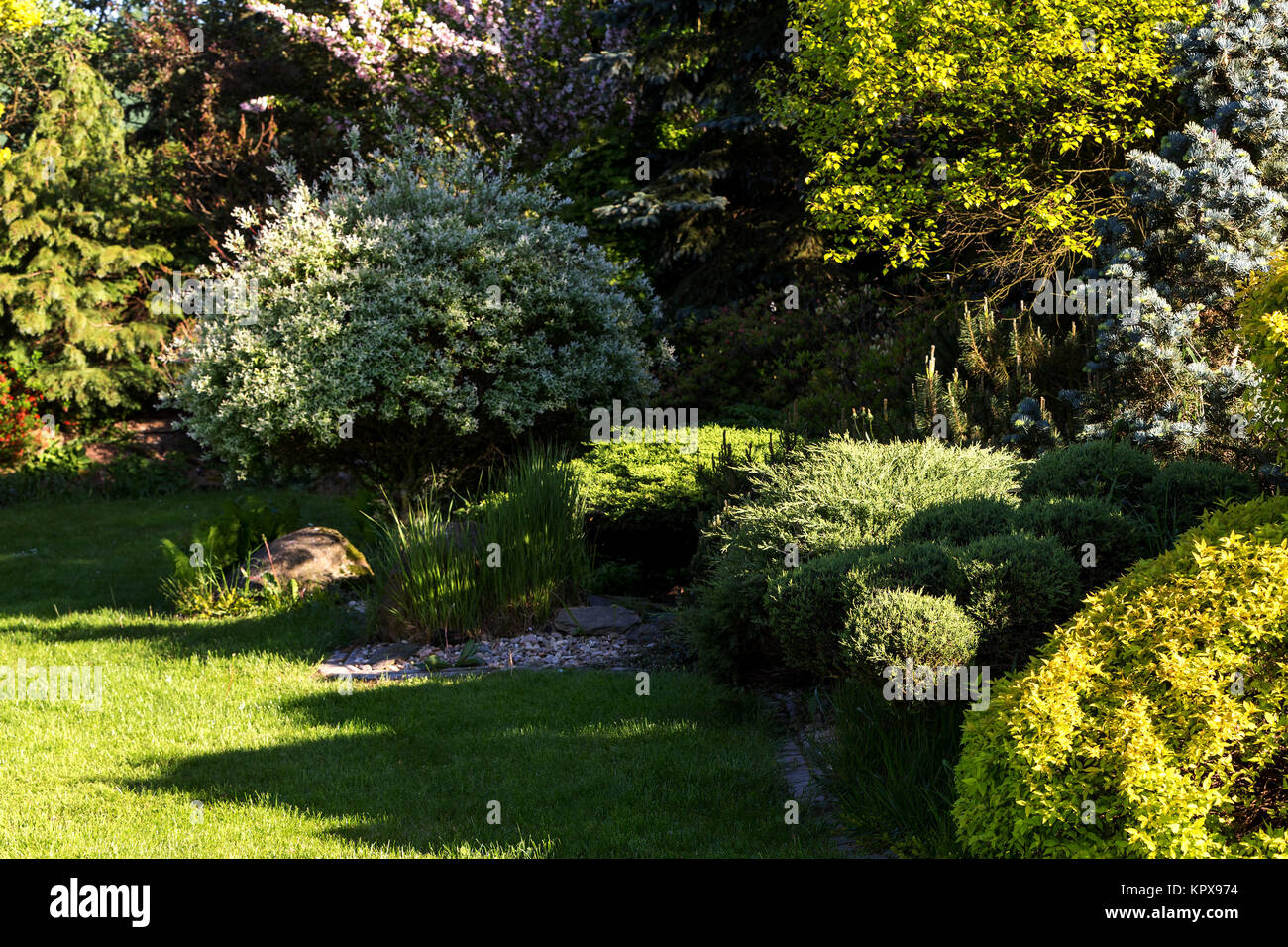 Beautiful spring garden design Stock Photo - Alamy