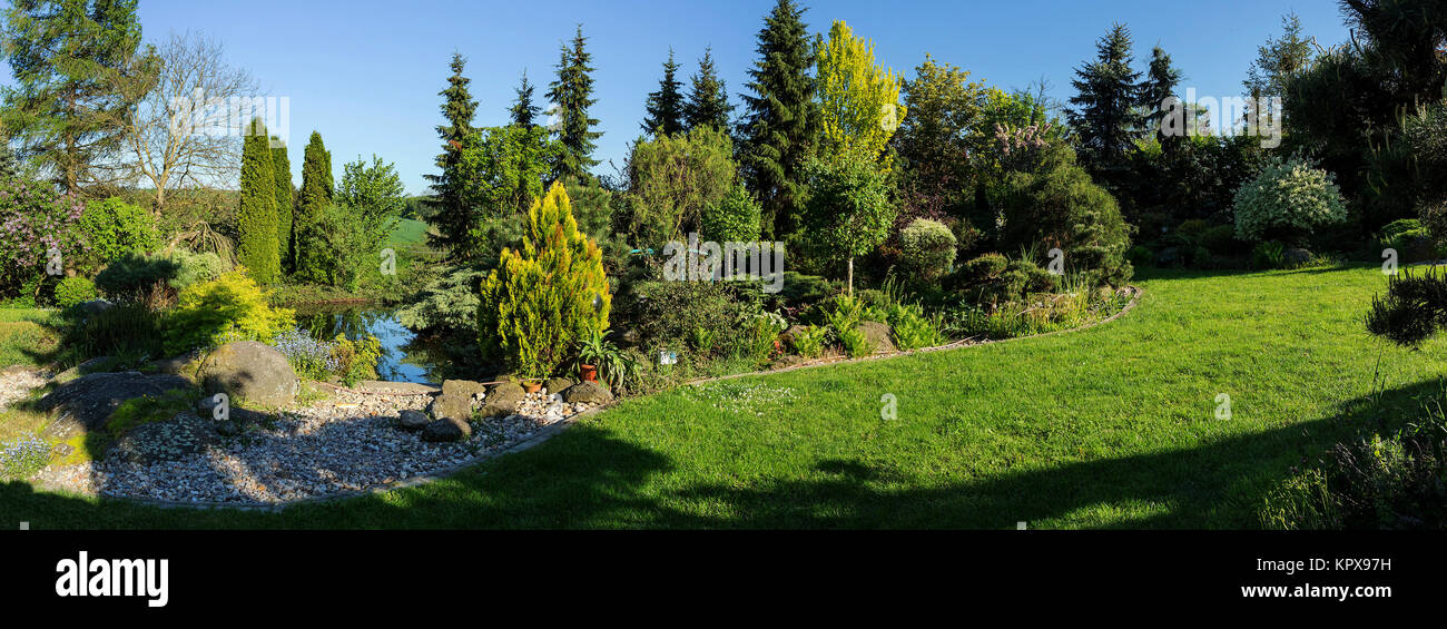 Beautiful spring garden design Stock Photo - Alamy