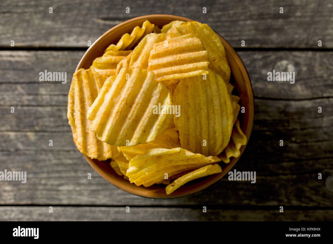 Crinkle cut potato chips Stock Photo - Alamy