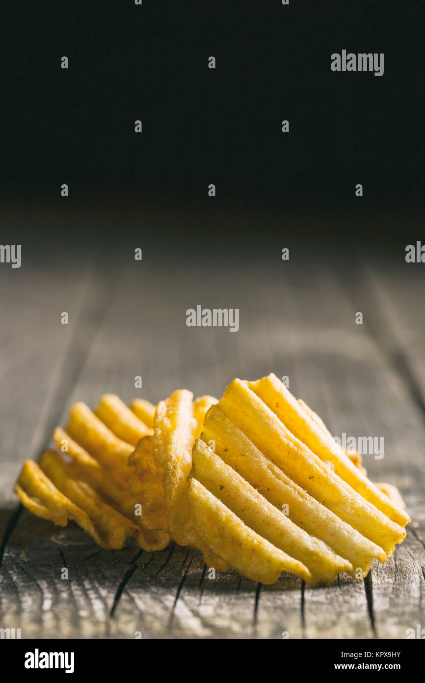 Crinkle cut potato chips Stock Photo - Alamy