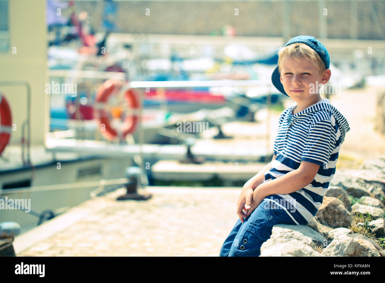 Boy in the port Stock Photo - Alamy