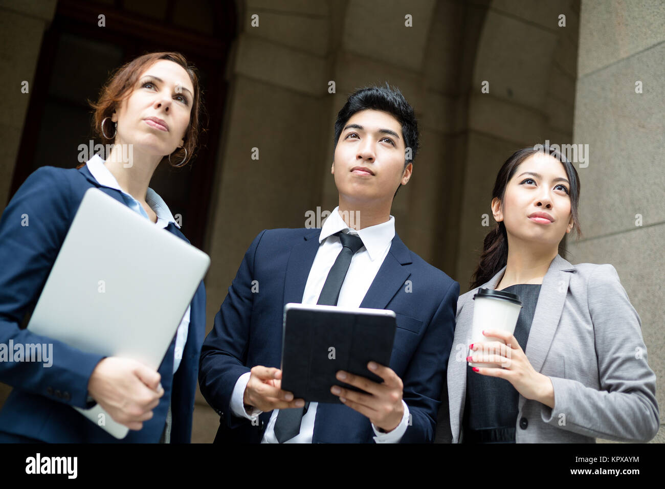 Business team looking away Stock Photo - Alamy