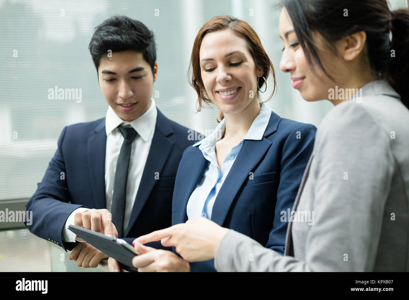 Grooup of business people use of tablet computer together Stock Photo ...