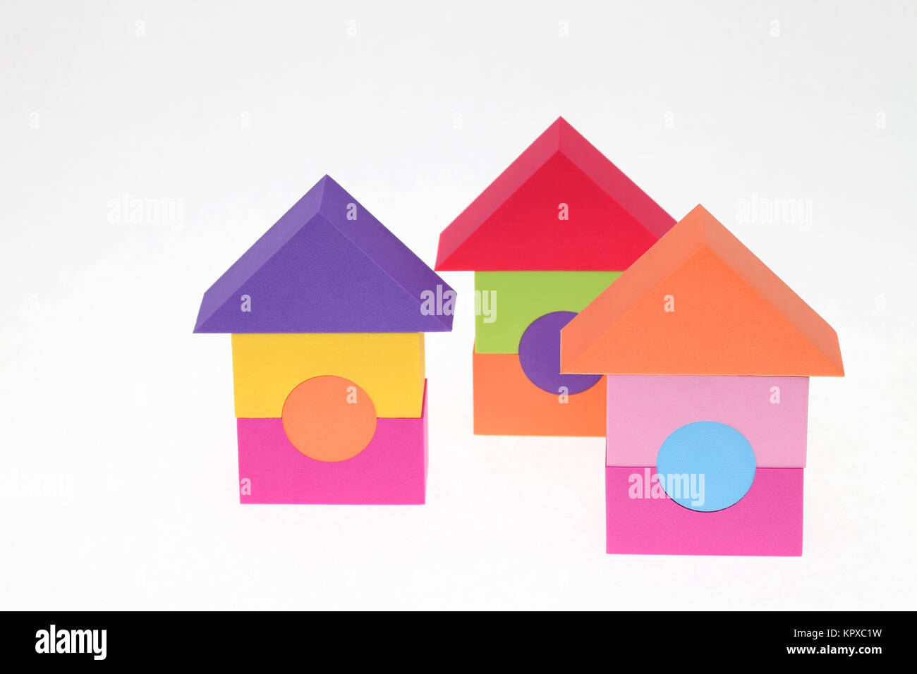 Toy house made of plastic bricks on white background Stock Photo - Alamy