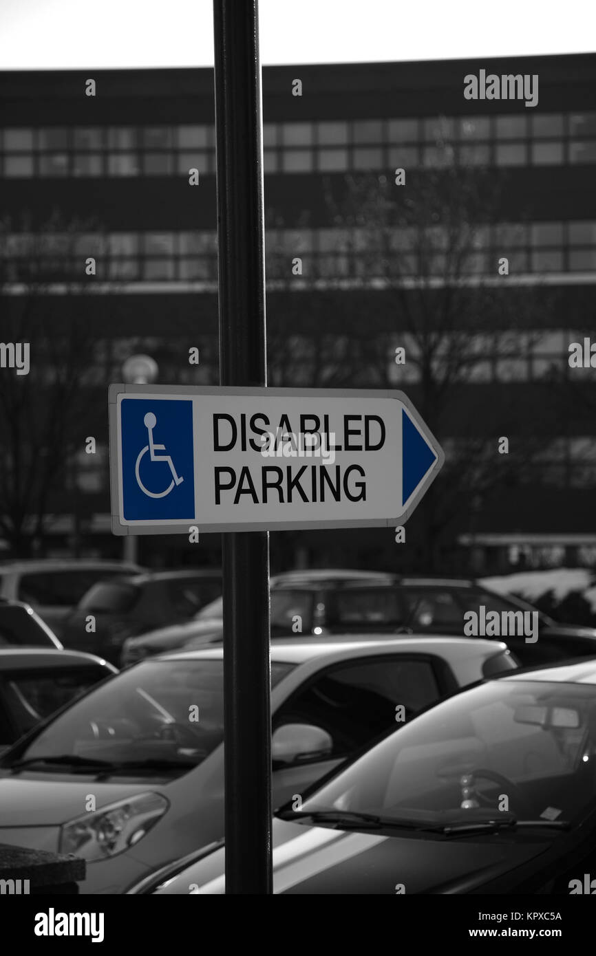Disabled parking sign at a car park with selective color Stock Photo ...