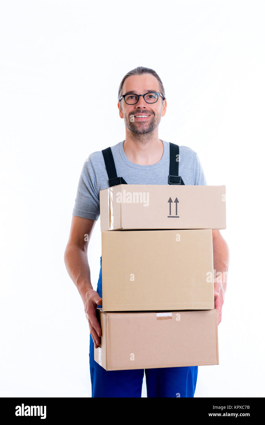 friendly postman with parcels in front of white background Stock Photo ...